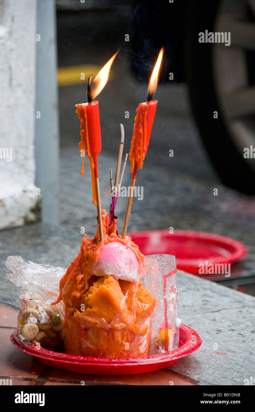 Makeshift incense shrine on city street in Singapore Stock Photo - Alamy