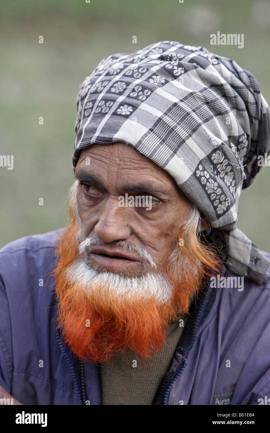 Portrait of an elderly Pakistani man with his beard dyed red, Bani ...