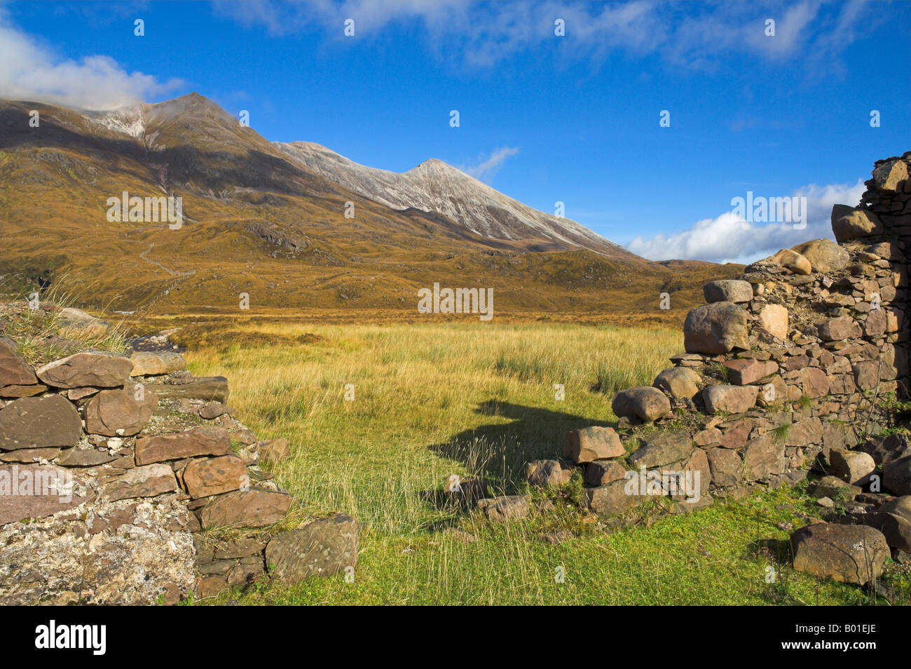 Ruined croft stone walls at the foot of Beinn Eighe in the national ...