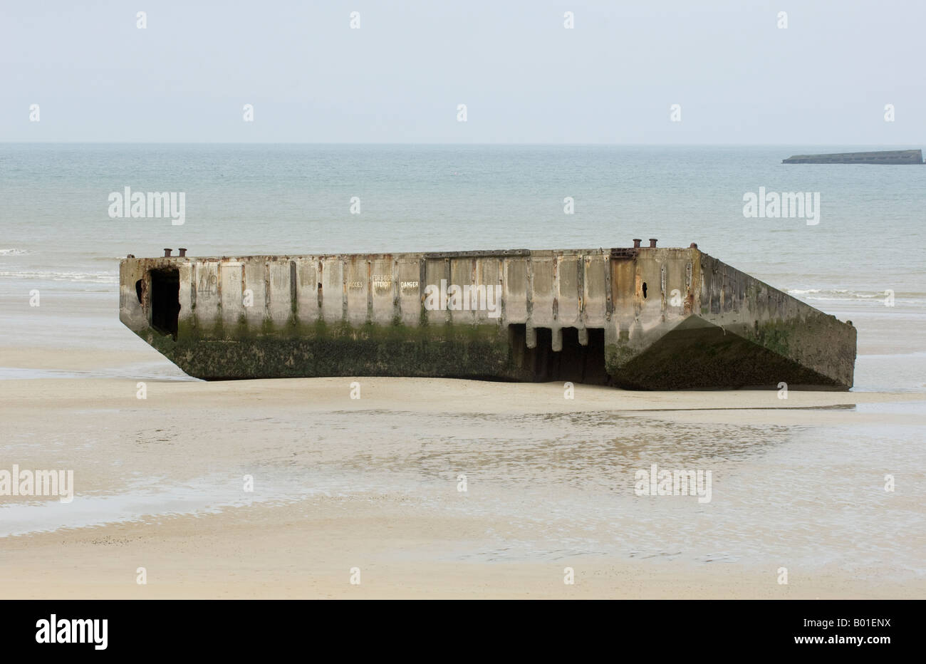 Mulberry harbour section on the beach at Arromanches, Normandy, left ...