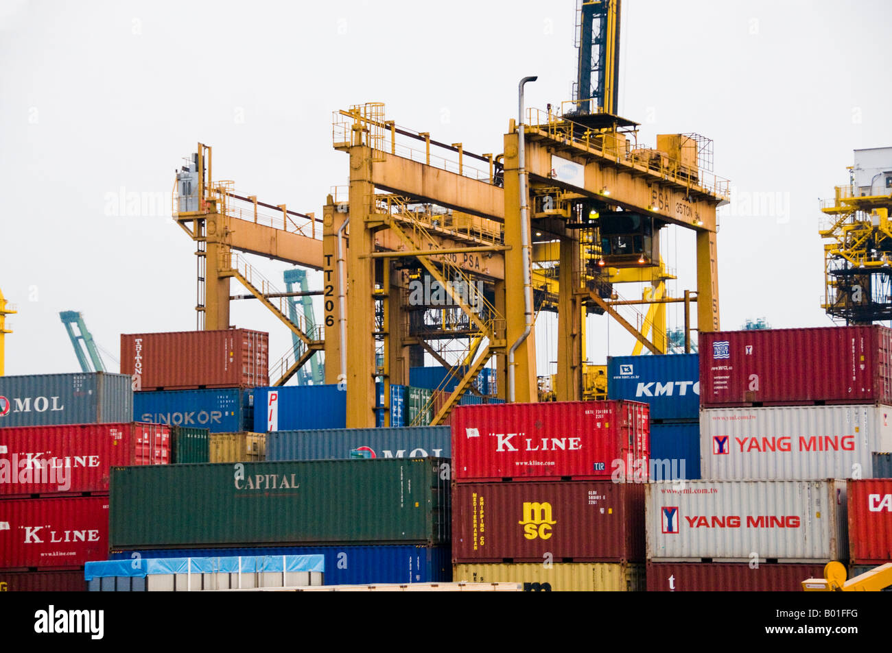 Stacks of large overseas shipping containers waiting to be loaded on ...