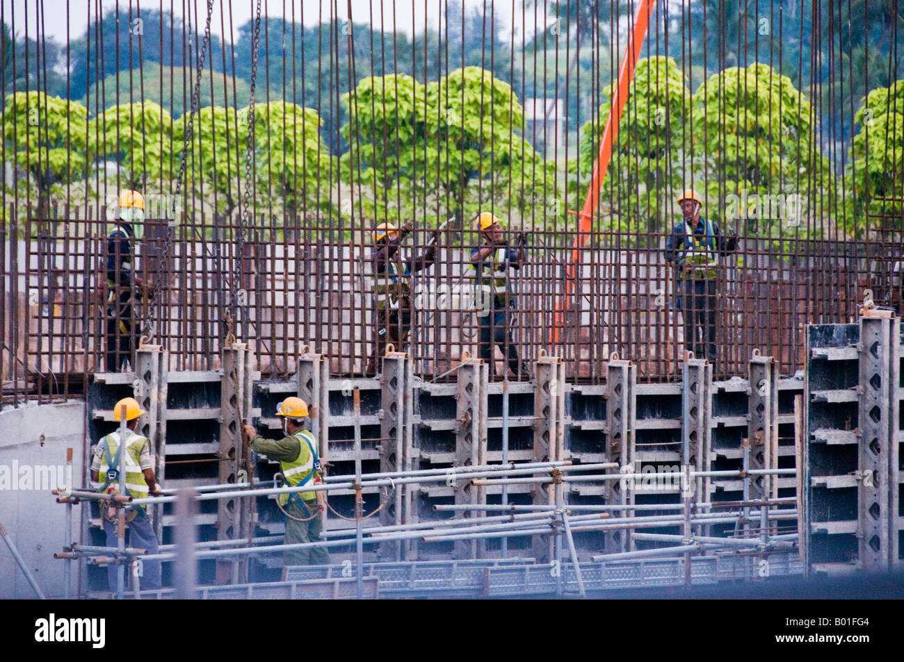 Construction workers building rebar supports for concrete wall Stock ...