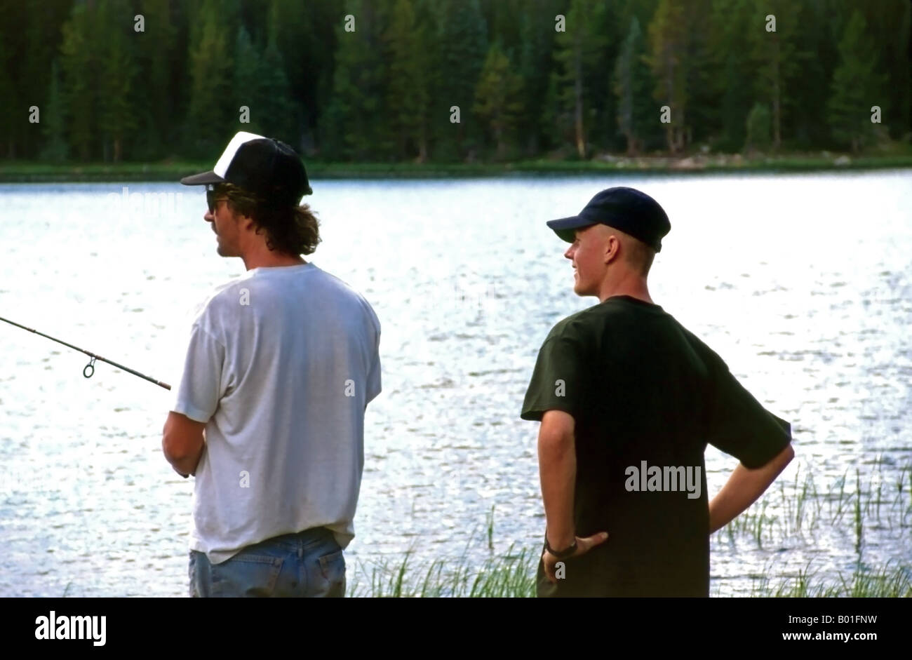 Friends and neighbors enjoying a bit of fishing together on a high ...