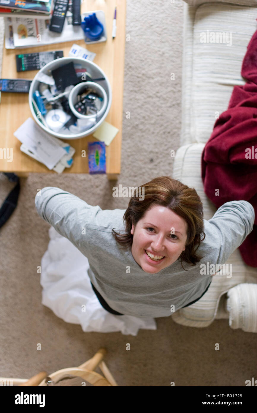 A woman looking up in a small loft apartment Stock Photo - Alamy