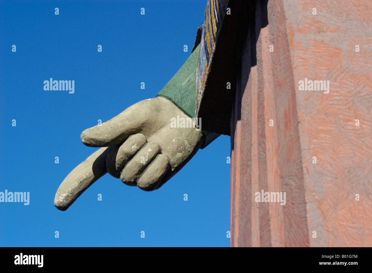 Giant hand shows downward Stock Photo - Alamy