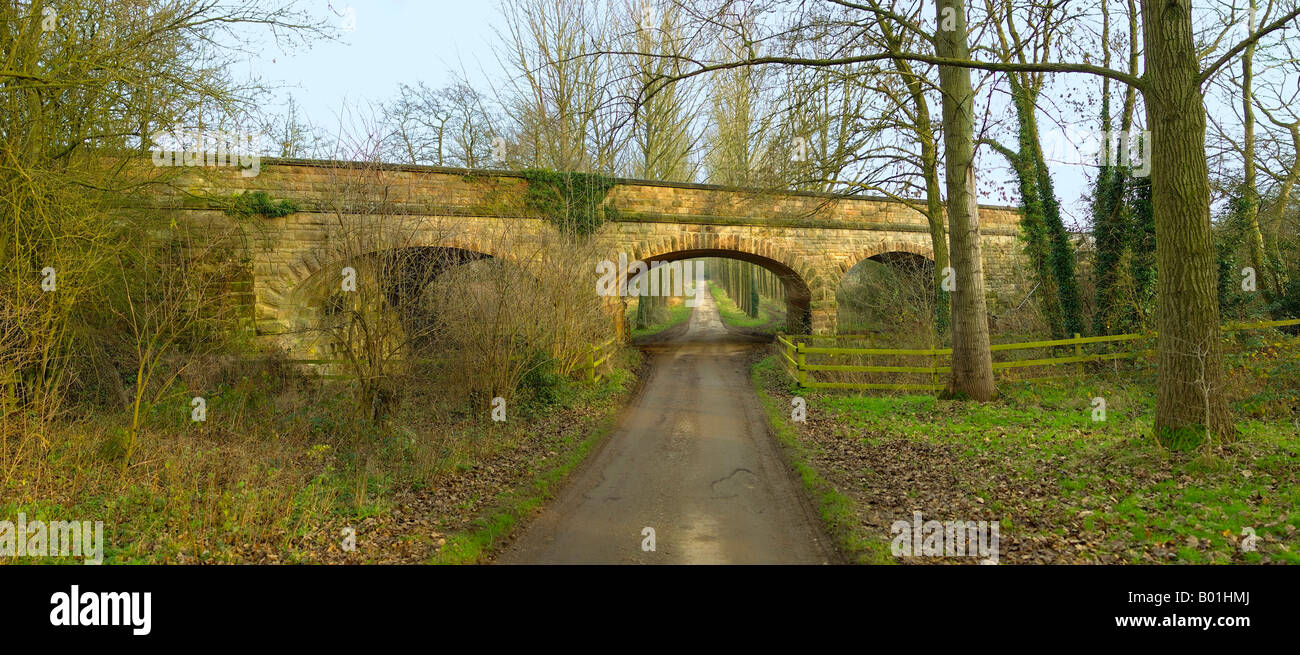 railway bridge over road country lane footpath countryside Stock Photo ...