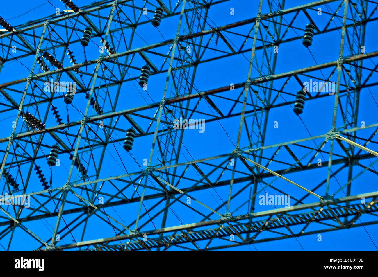Power Grid - electric tower with clear blue sky as a background Stock ...