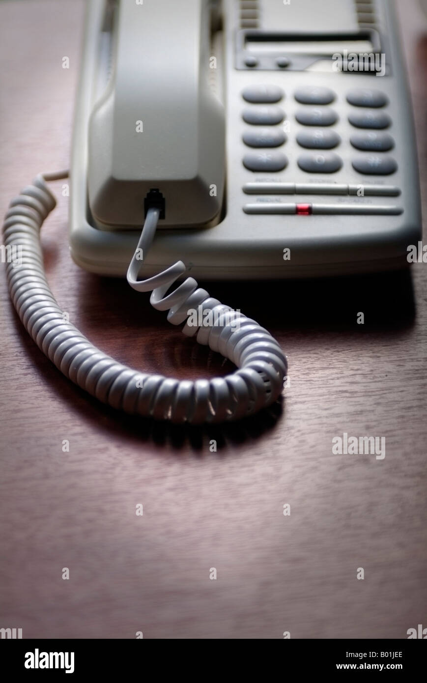 white telephone on wooden desk Stock Photo - Alamy