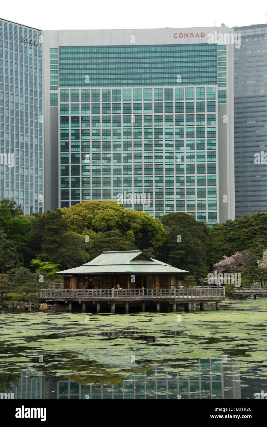 Hamarikyu Garden's Nakajima no chaya tea house with the Conrad hotel in ...
