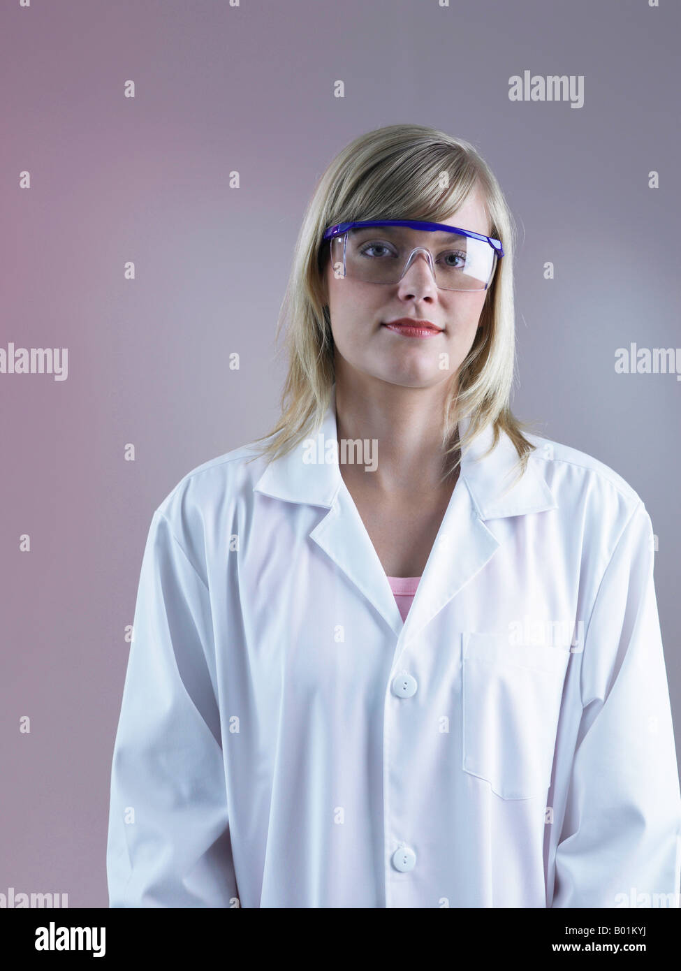 Young female doctor wearing goggles Stock Photo - Alamy