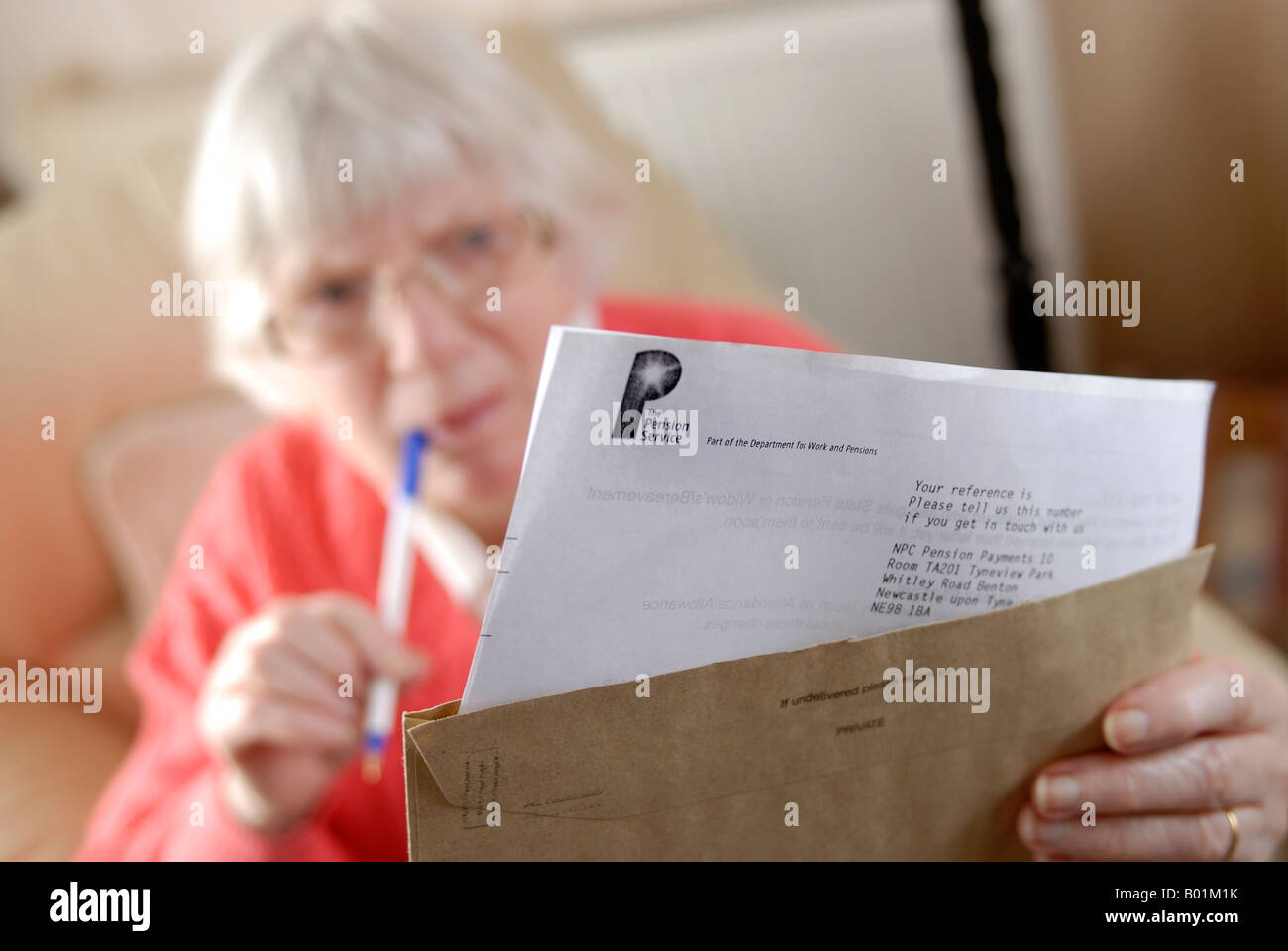 Mature woman with Pension statement Stock Photo - Alamy