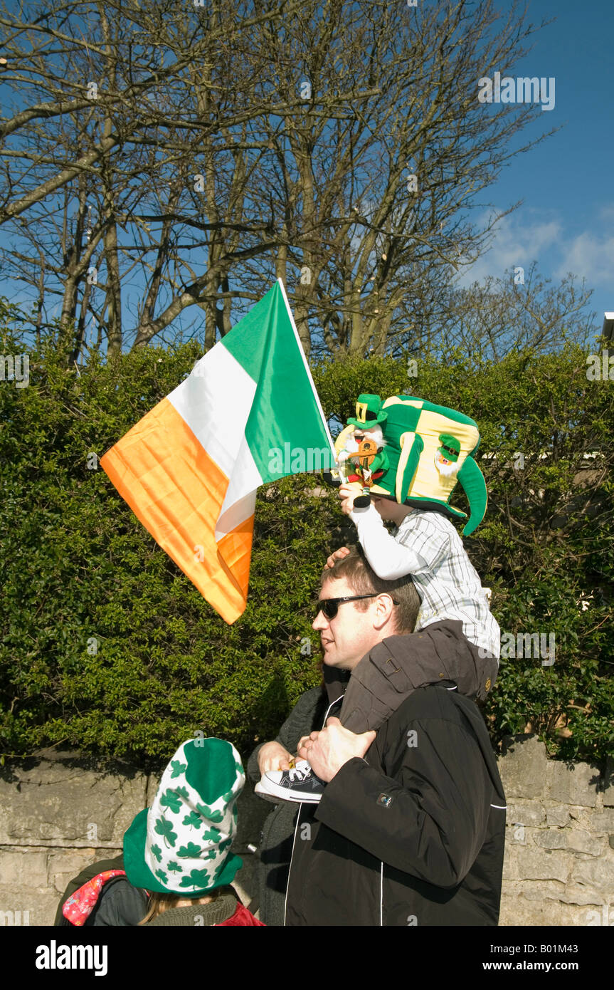 Waving the flag at the Saint Patrick's Day parade in the village of ...