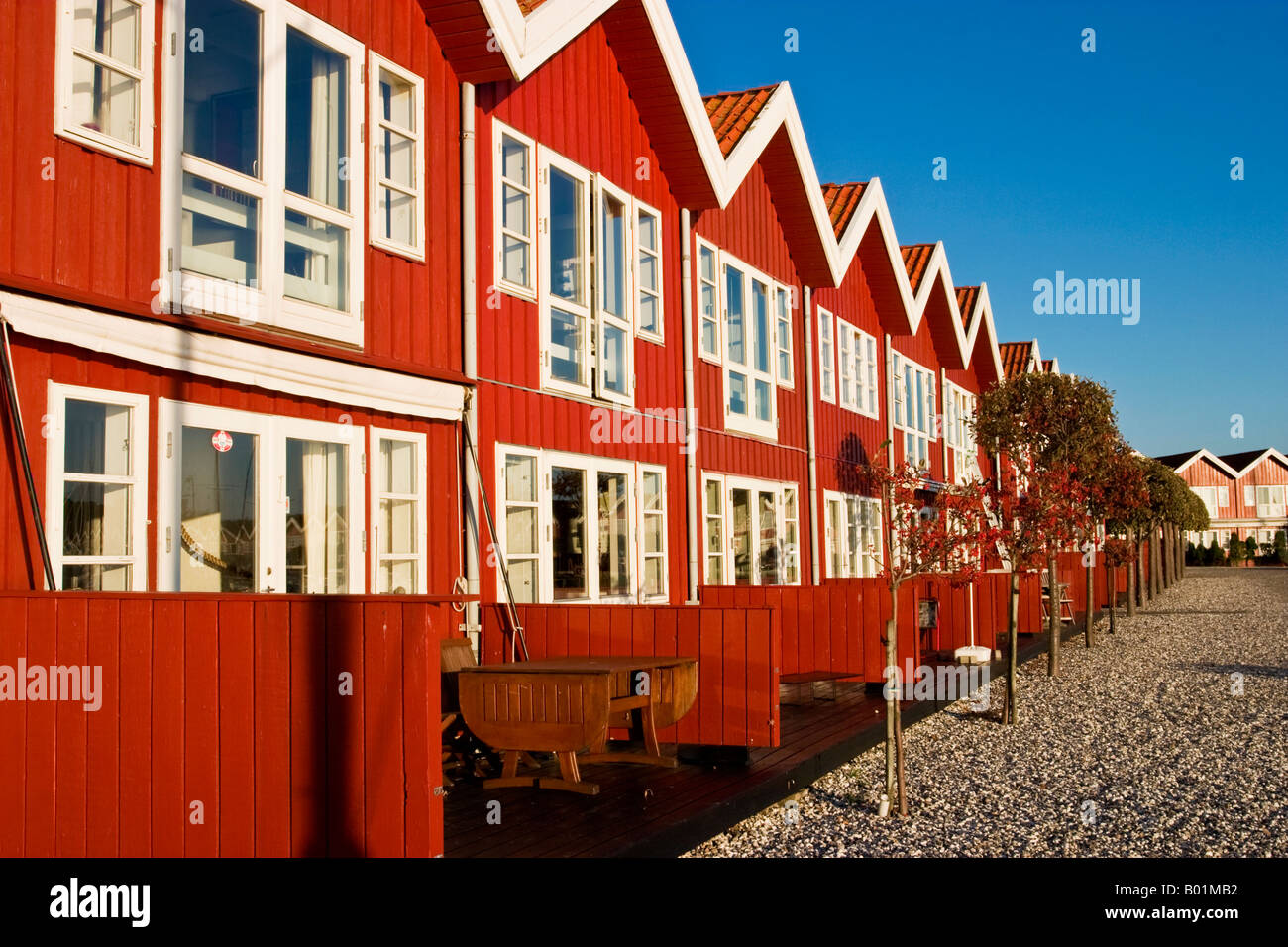 Red wooden terrace house Stock Photo - Alamy