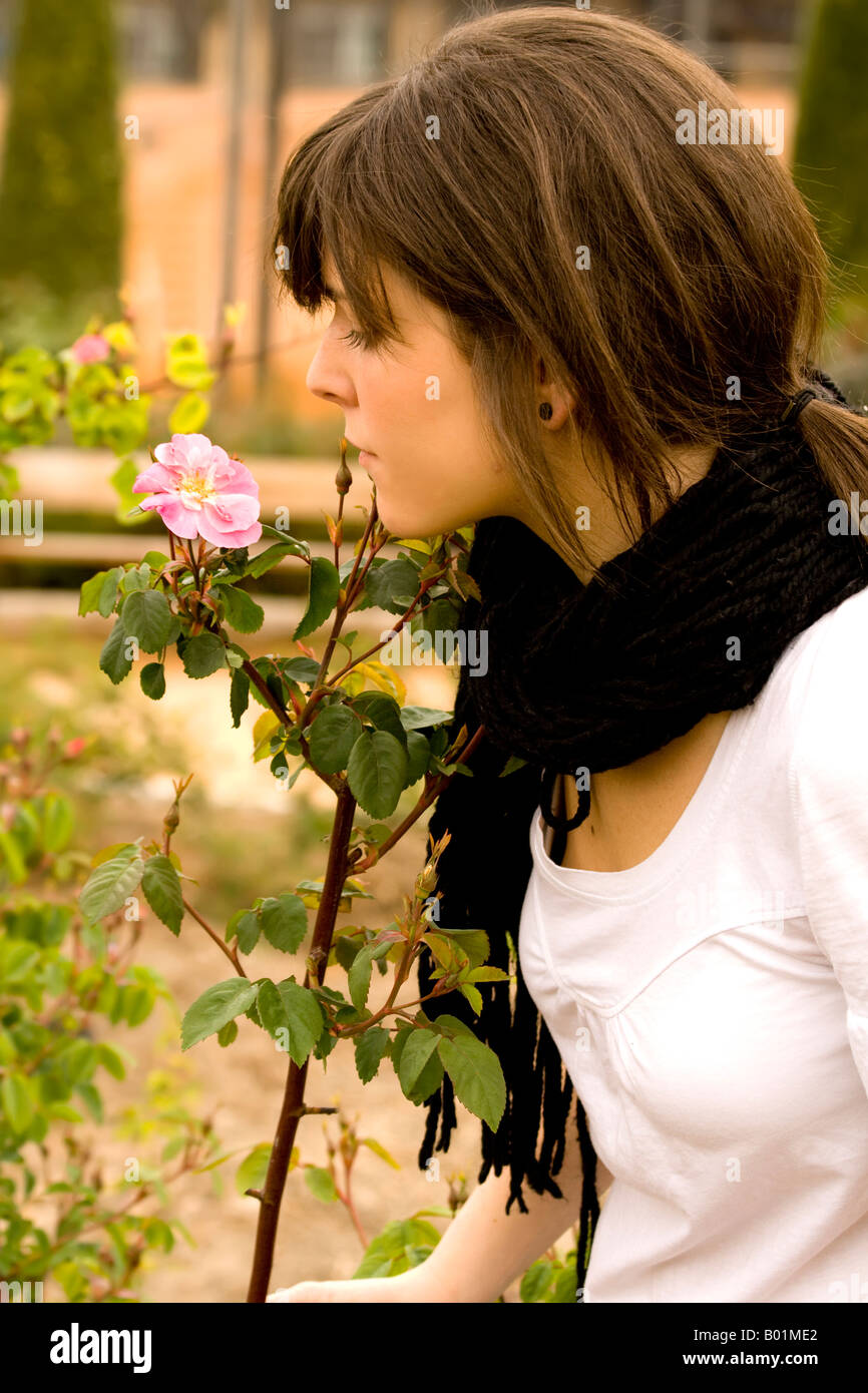 girl smelling a flower Stock Photo - Alamy