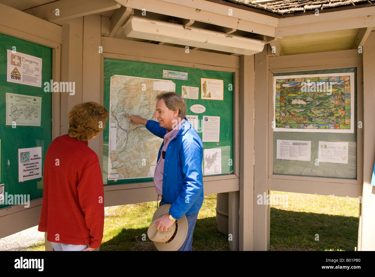 Caucasian Couple (50-55) Reading Trail Map at Davidson River Campground ...
