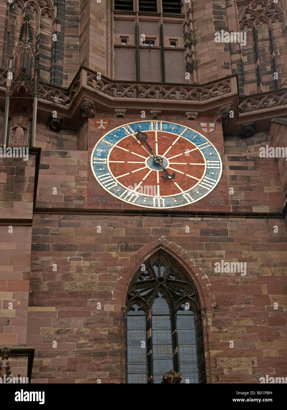 part of facade of the cathedral with a clock Freiburg im Breisgau Baden ...