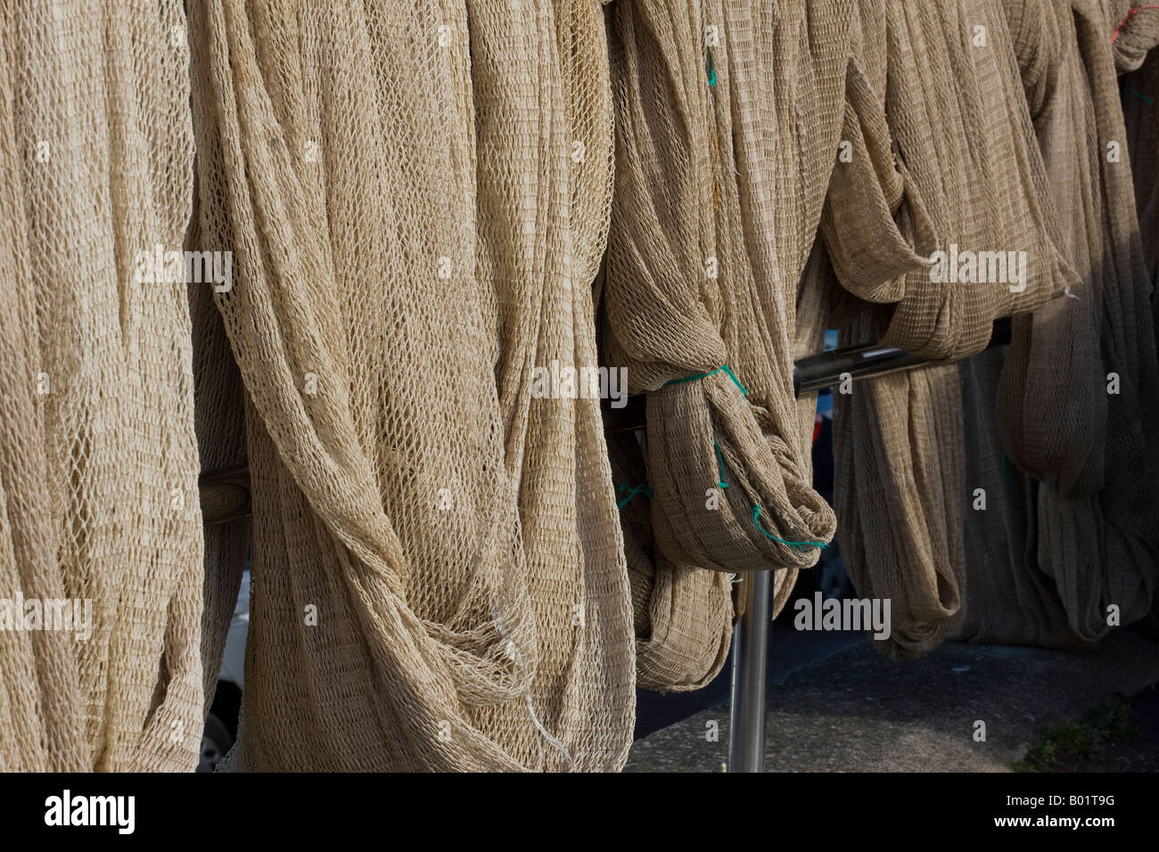 fishing net hanging to dry Stock Photo - Alamy