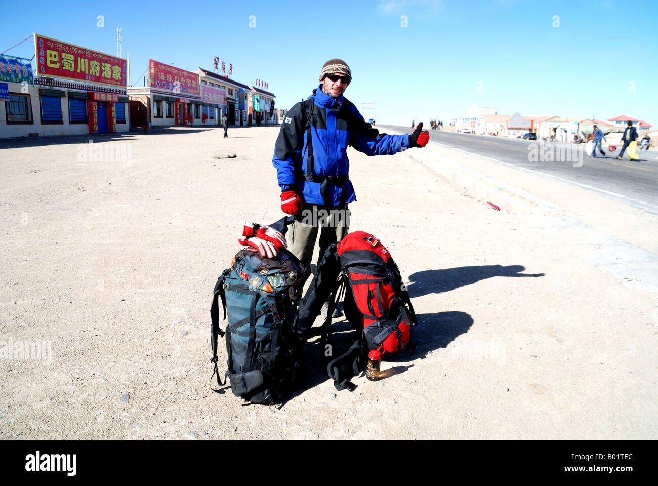 a foreigner tourist in china Qinghai lake waiting for bus Stock Photo ...