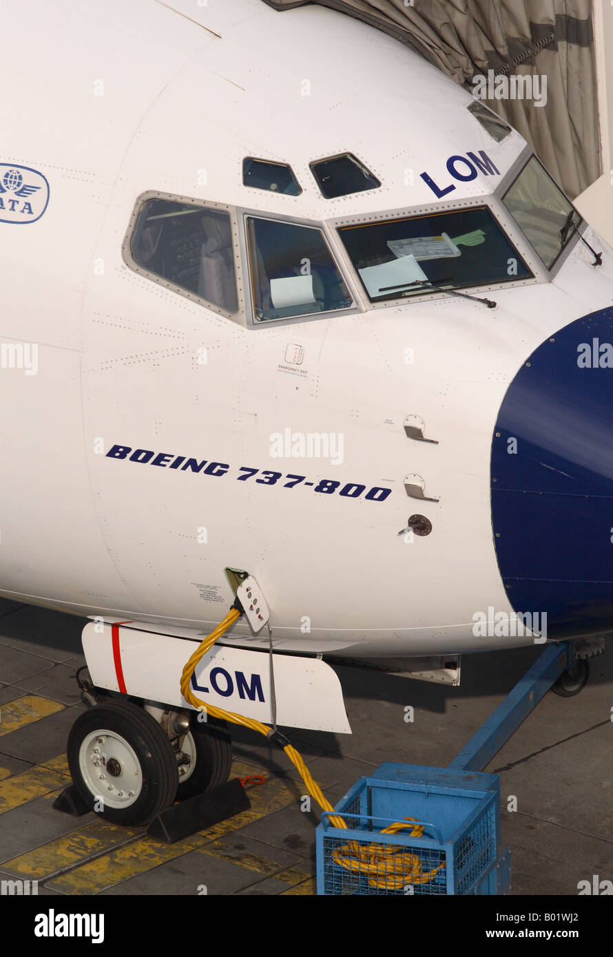 Boeing 737 airline nose section and cockpit close up detail at airport ...