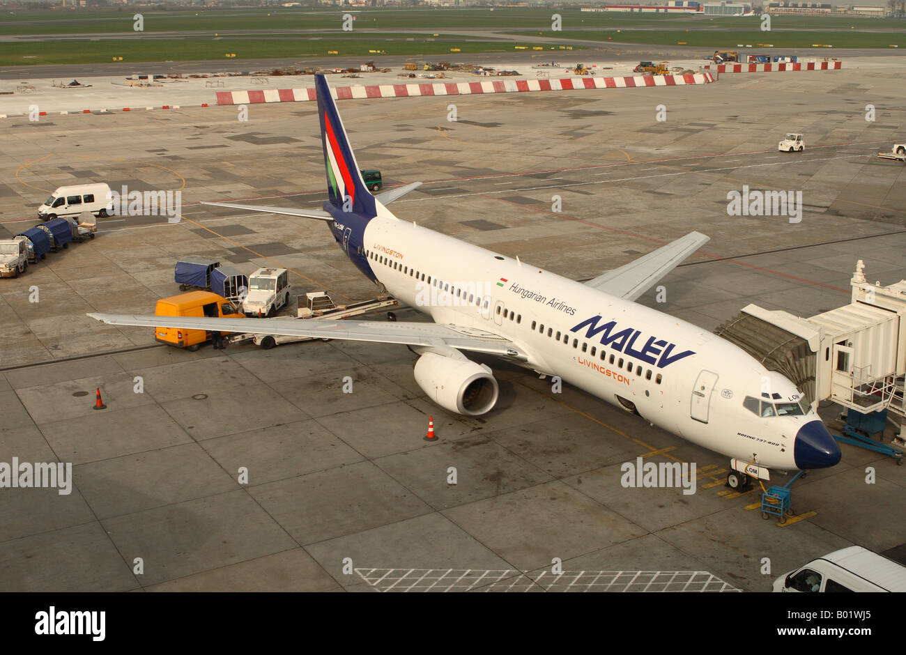 Malev Hungarian Airlines Boeing 737 parked at airport terminal gate ...