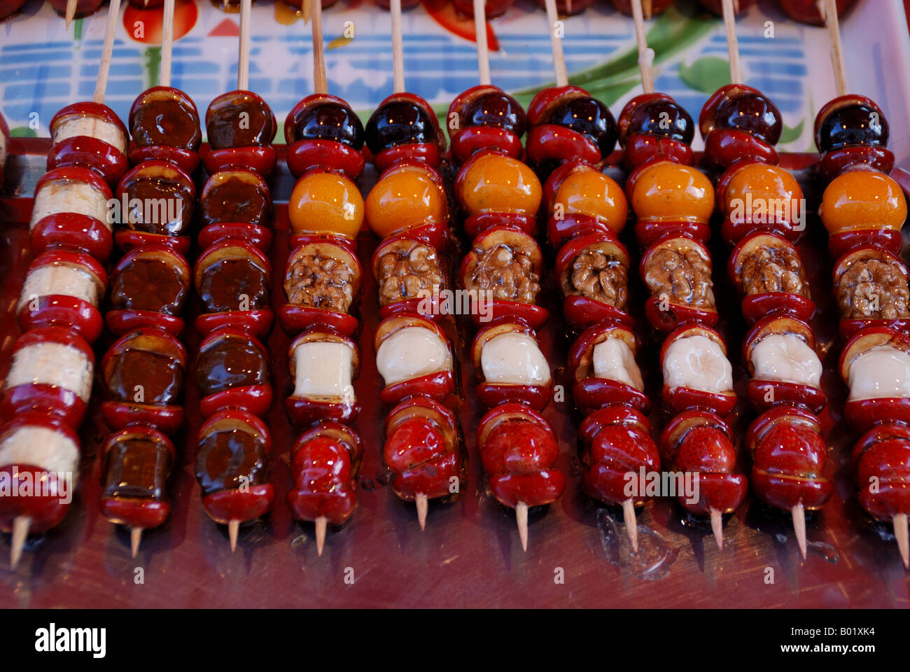 a stick of sugar-coated haws (or apples,etc fruit Stock Photo - Alamy