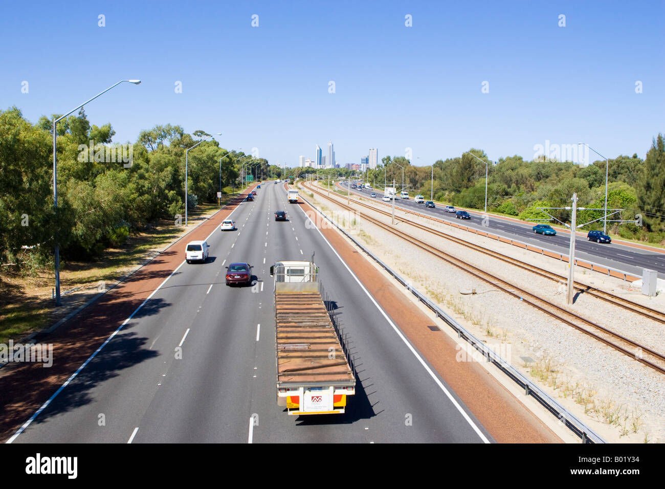 Traffic on the Mitchell Freeway heading towards Perth, Aus. Skyscrapers ...