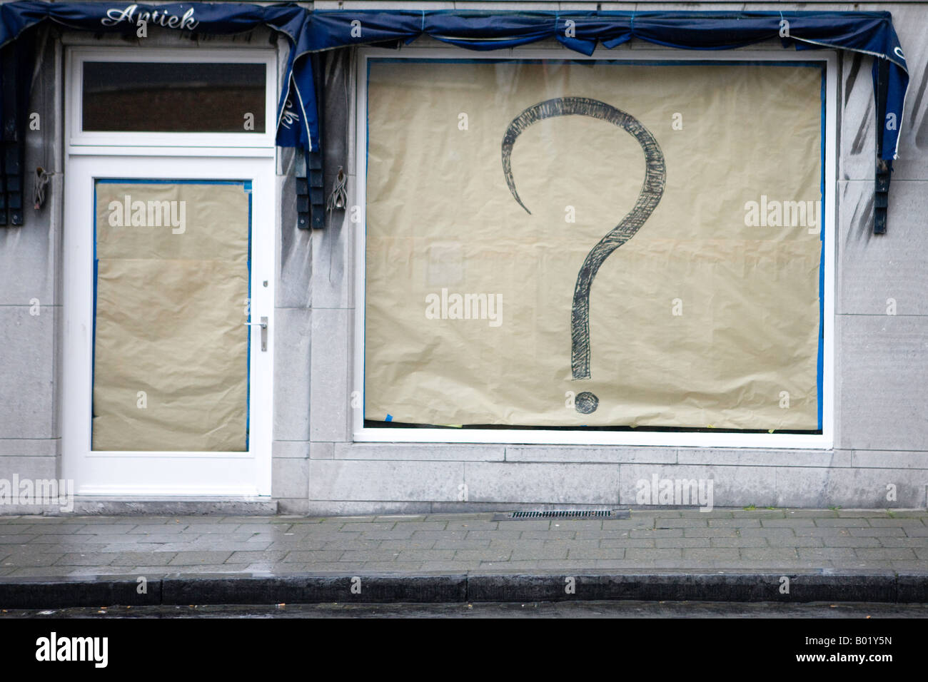 Question mark in shop window Stock Photo - Alamy