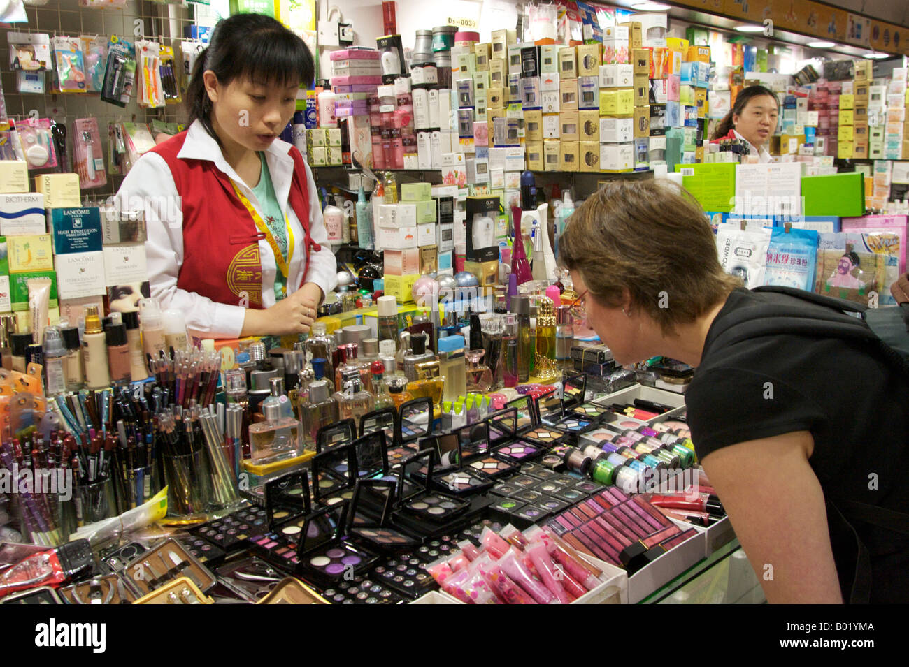 Tourist looking at counterfeit cosmetics at the Xiushui silk market ...
