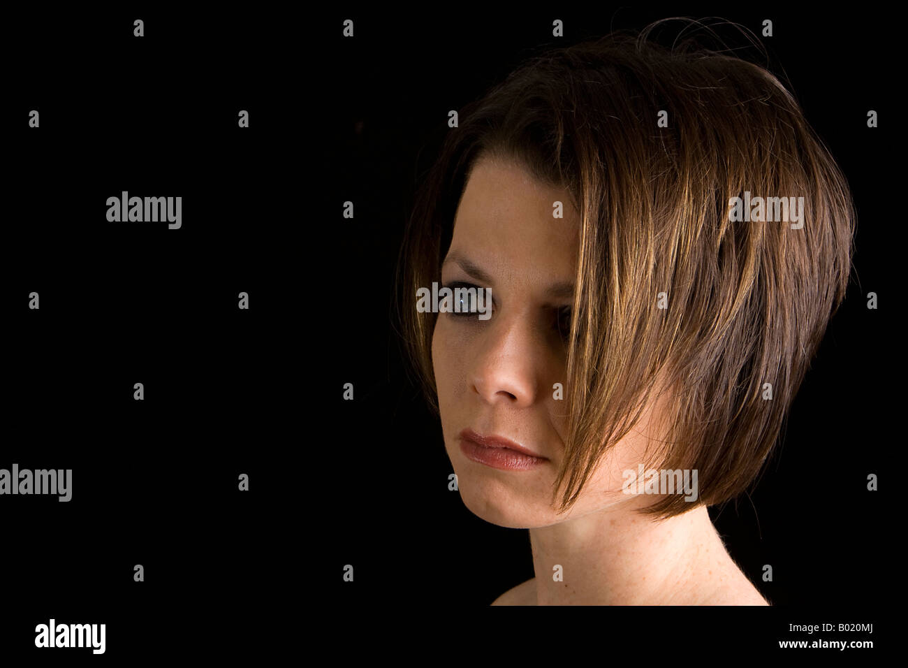 Attractive Brunette Girl in Studio - Looking off Camera Stock Photo - Alamy