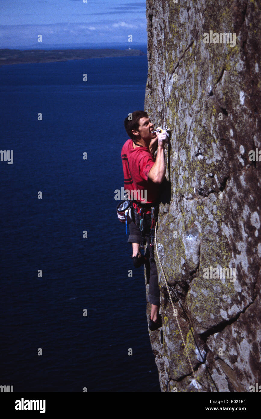 Ricky Bell climbing on the Rathlin Wall at Fairhead Stock Photo - Alamy