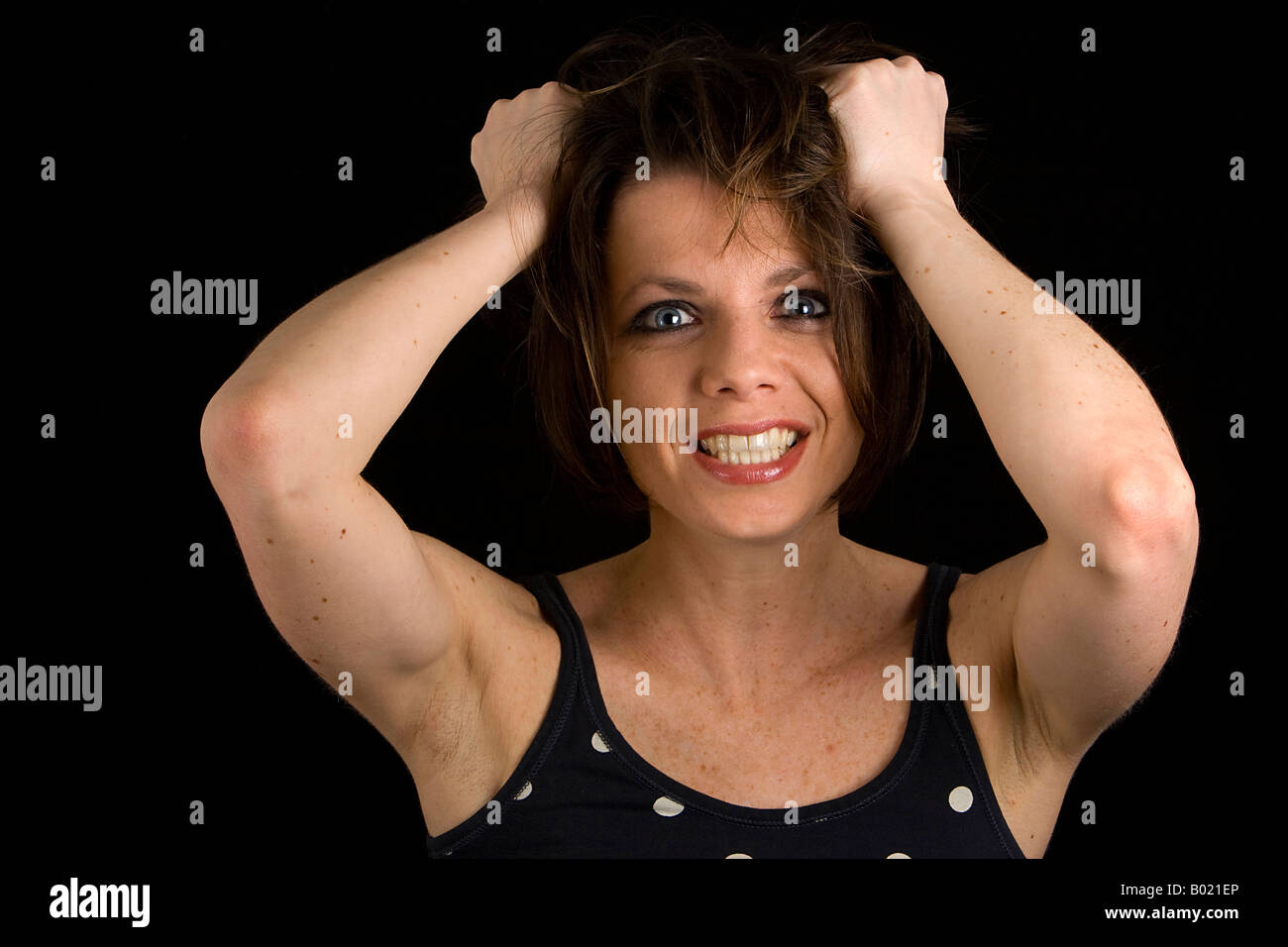 Attractive Brunette Pulling her Hair Out Stock Photo - Alamy