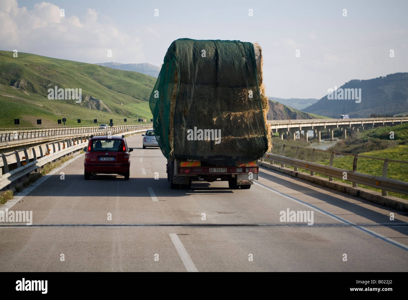 Car overtaking a lorry on the highway Sicily Italy Stock Photo - Alamy