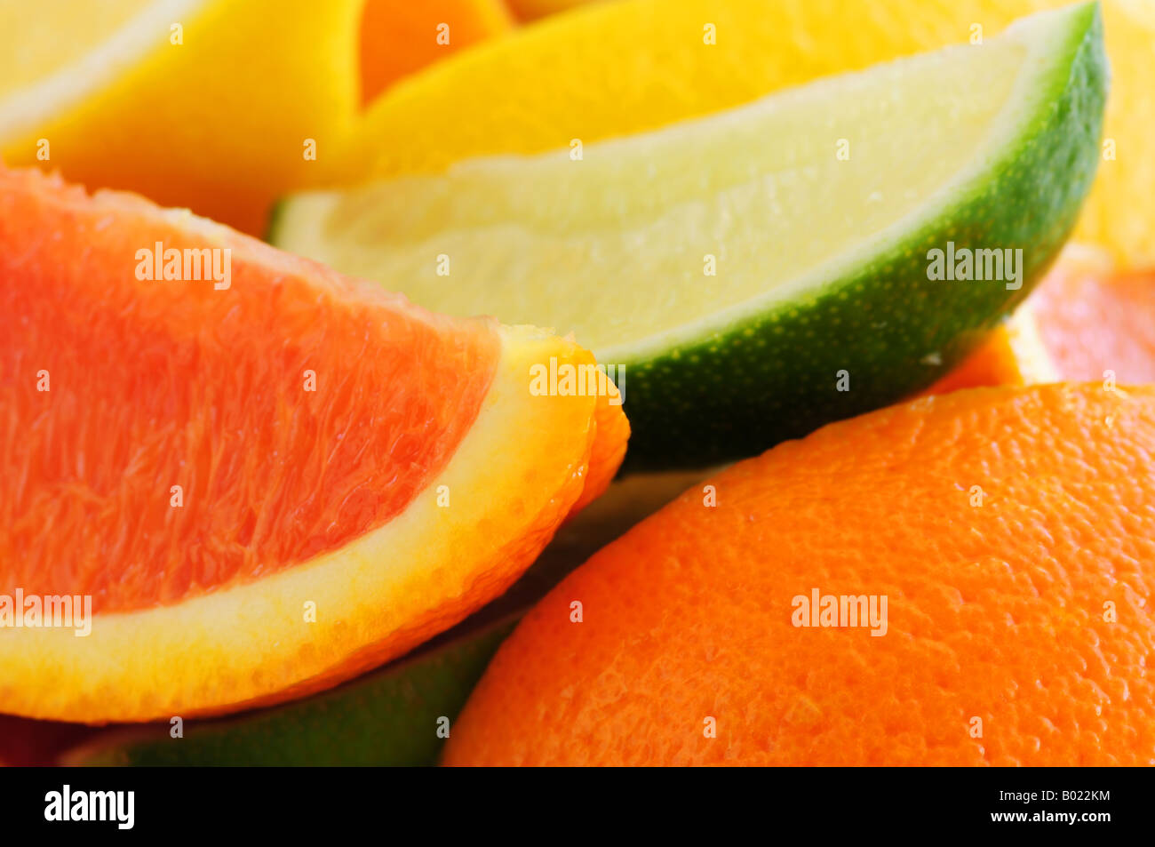 Wedges of assorted citrus fruits lemon orange and lime Stock Photo - Alamy