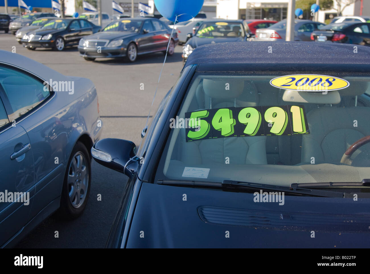 Luxury cars on display at a car lot Stock Photo - Alamy