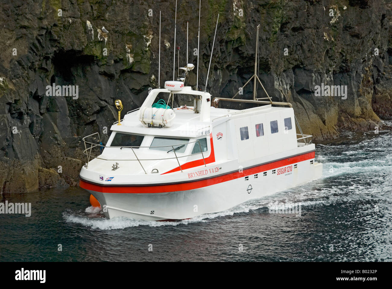 The passenger ferry arriving at Mykines Island, Faroe Islands Stock ...