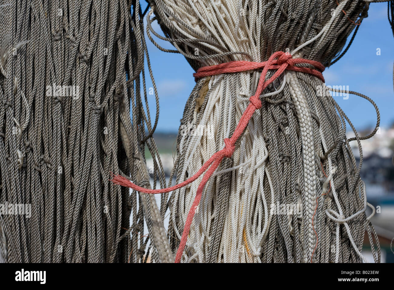 fishing net hanging to dry Stock Photo - Alamy