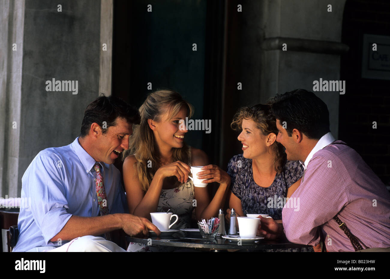 Friends Business Meeting Drinking Coffee at an Outside Cafe and ...