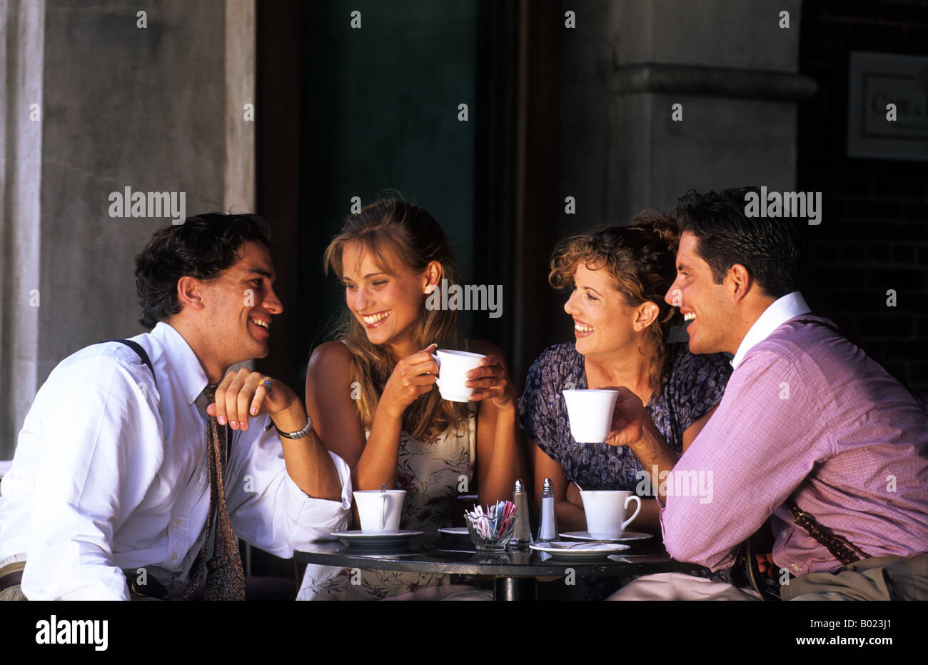 Friends Business Meeting Drinking Coffee at an Outside Cafe and ...