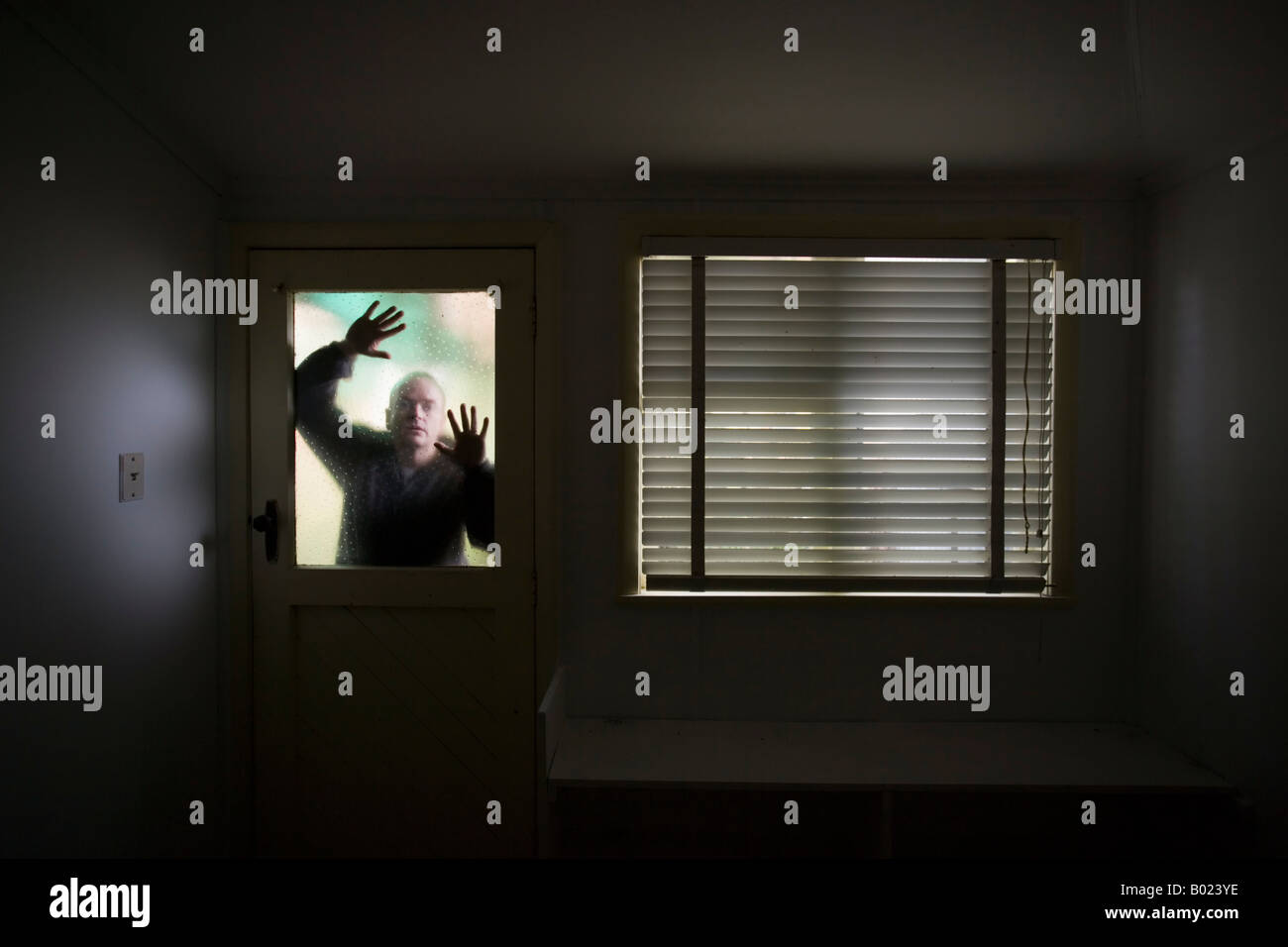 Face pressed against glass hi-res stock photography and images - Alamy