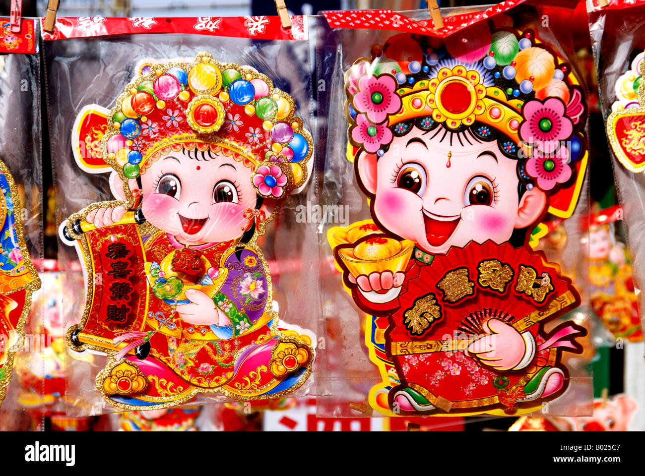 The Spring Festival luck girl and boy Stock Photo - Alamy