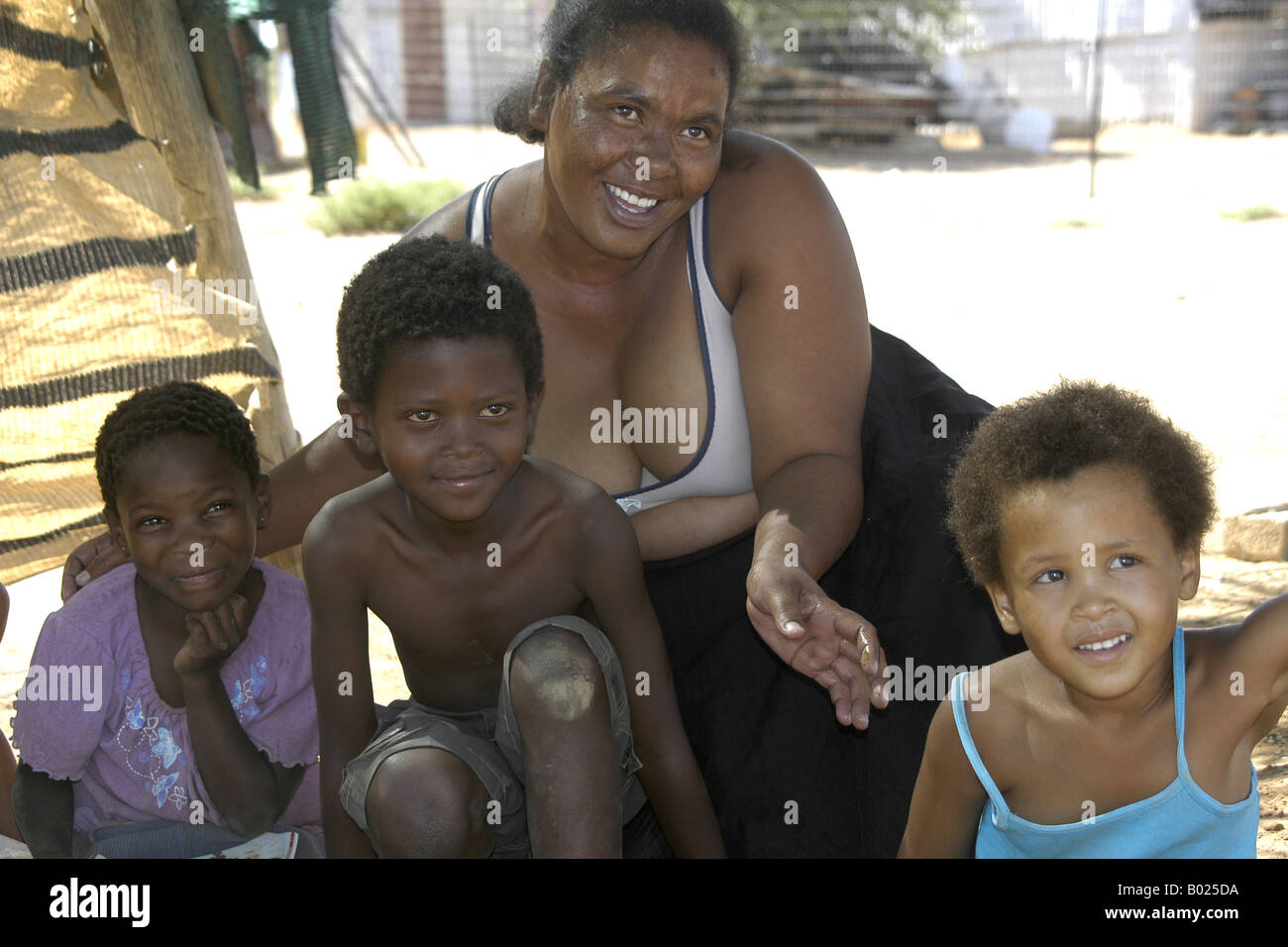 Mother with her three children Stock Photo - Alamy