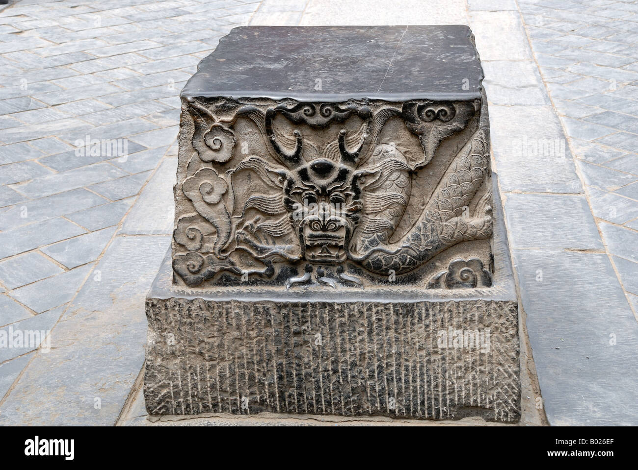 Carved stone polished by constant fondling by Chinese pilgrims at ...