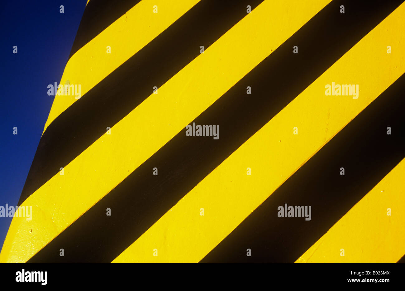 Detail of large warning sign or block with alternating diagonal yellow ...