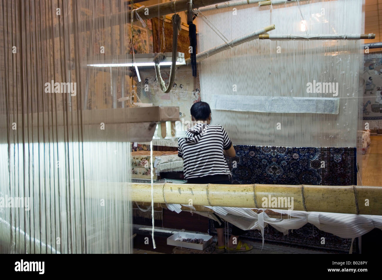 A chinese weaving silk chinese carpet Xi'an Shaanxi Stock Photo - Alamy