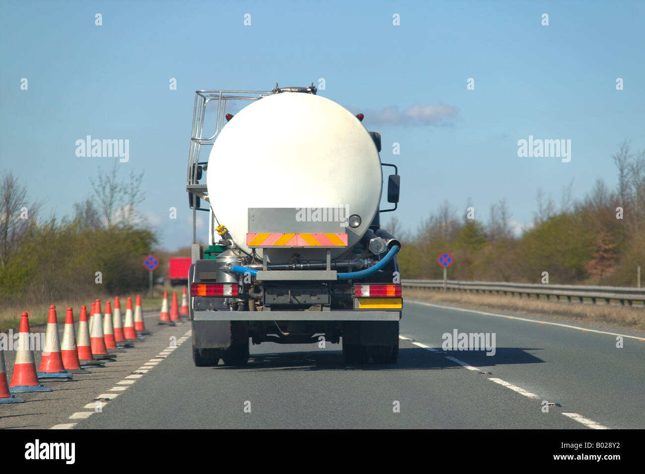 Rear view of a fuel tanker driving along a dual carriageway Stock Photo ...