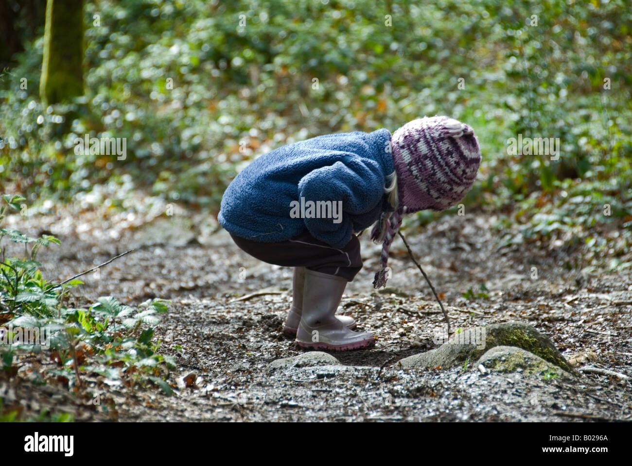 Girl stooping hi-res stock photography and images - Alamy