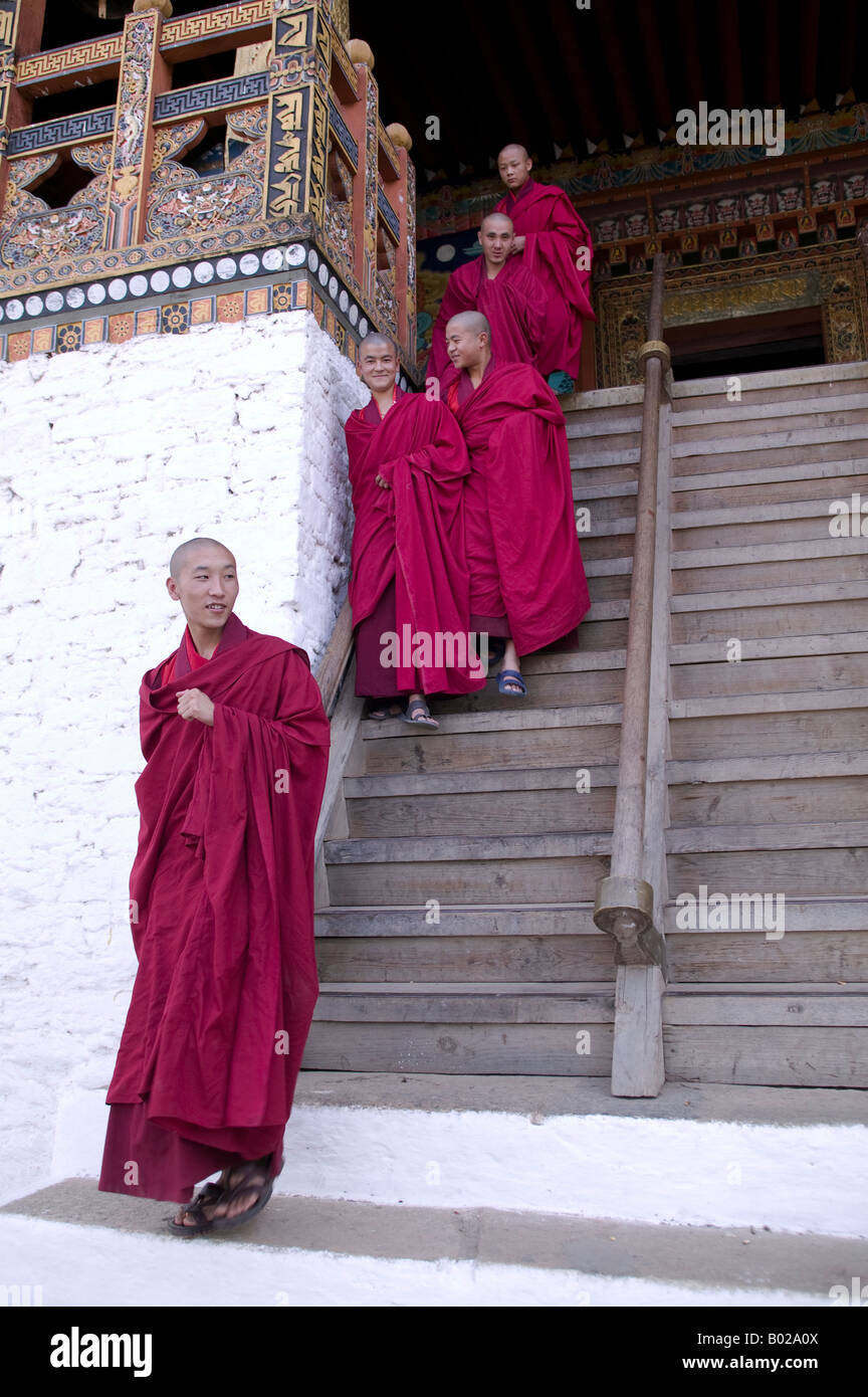 Monks existing a temple Stock Photo - Alamy
