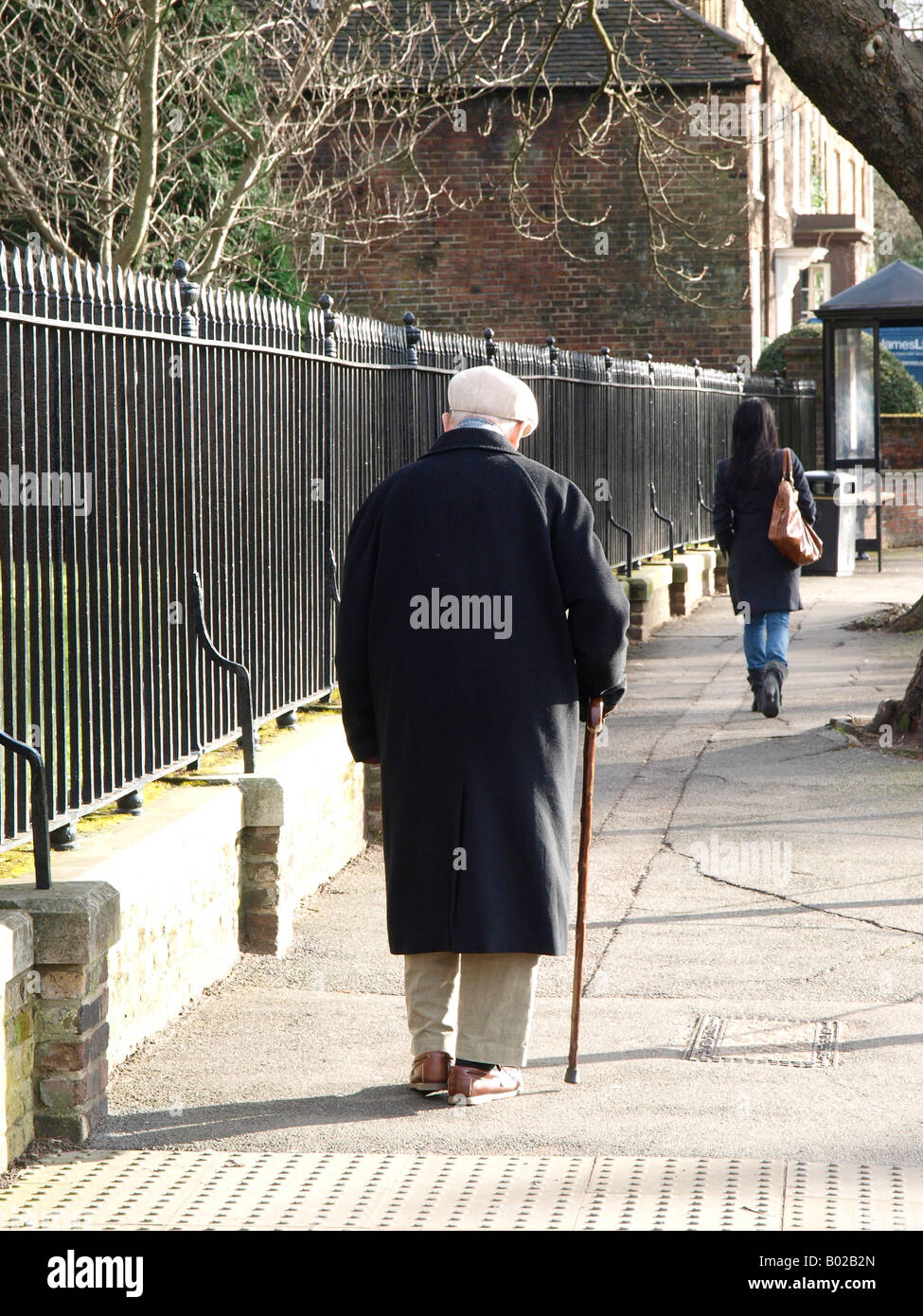 Elderly man walking in an urban environment Stock Photo - Alamy