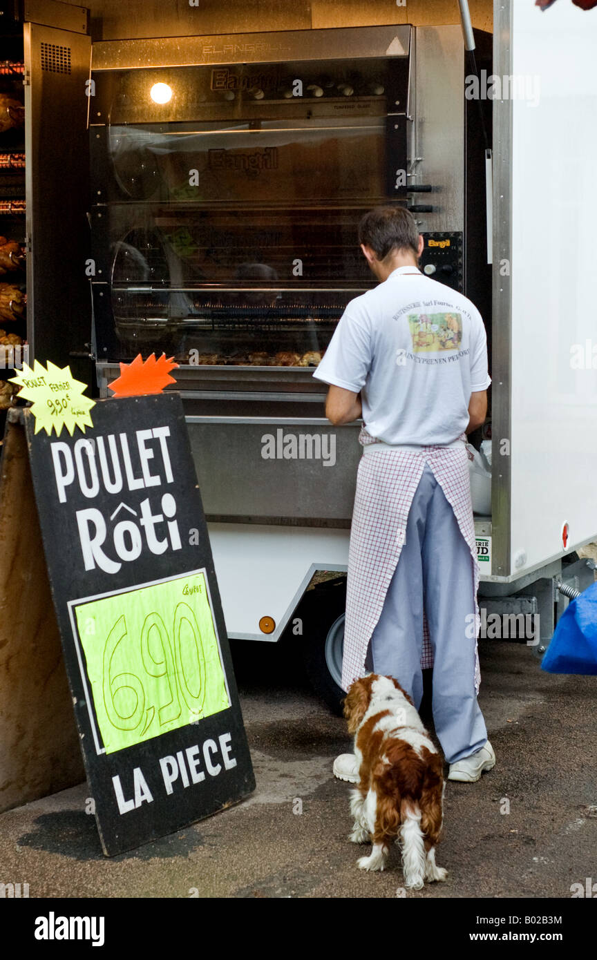 French poultry seller and dog Stock Photo - Alamy