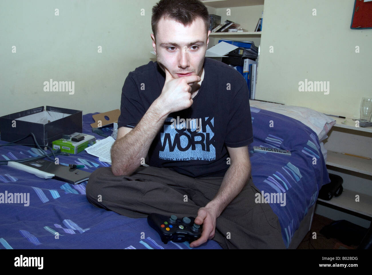 A young man playing a game on his X Box 360 Stock Photo - Alamy